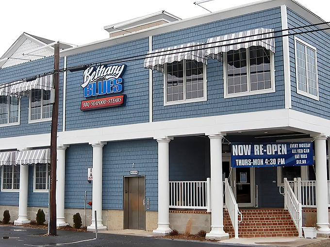 The blue-shingled beacon of BBQ excellence stands proud on Coastal Highway, its classic beach architecture promising smoky delights within these Delaware shores.