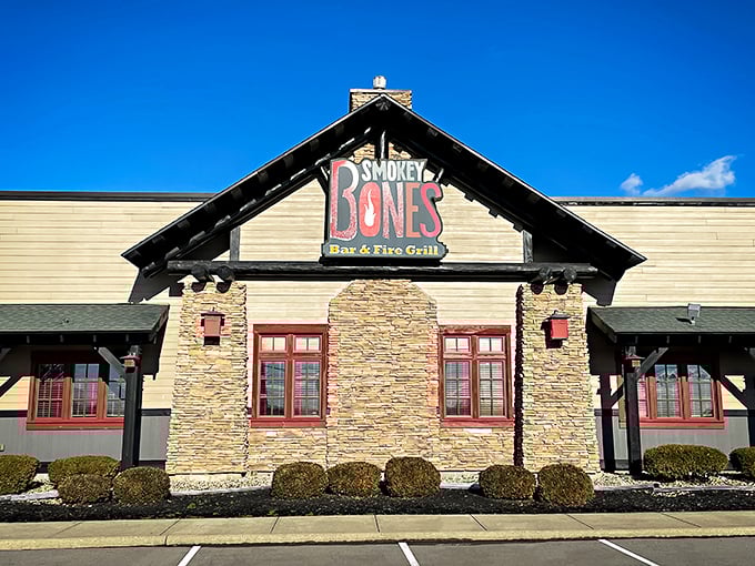 A rustic lodge or a barbecue haven? At Smokey Bones, it's deliciously both. This stone-faced facade promises a meaty adventure that'll make your taste buds do a happy dance.