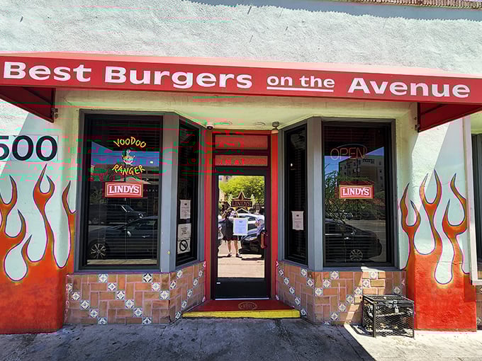 Flame on! Lindy's exterior is a siren call to burger lovers, with its fiery decor and bold promise of "Best Burgers on the Avenue."