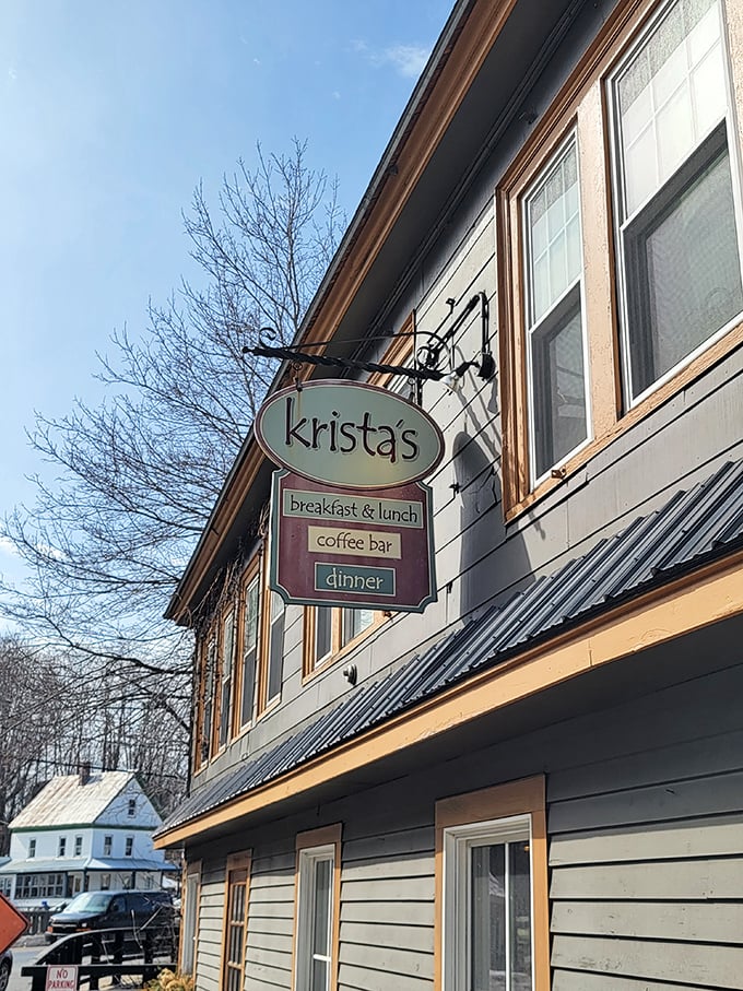 Welcome to flavor town! Krista's charming exterior invites you in with its cozy porch and colorful flag, promising a feast for all senses.