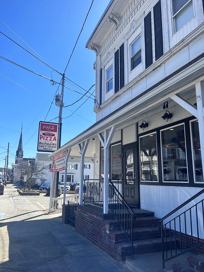 A slice of Americana with a side of pizza! This charming white clapboard building houses Tilton's worst-kept secret - a pizza paradise that's been drawing locals for decades.