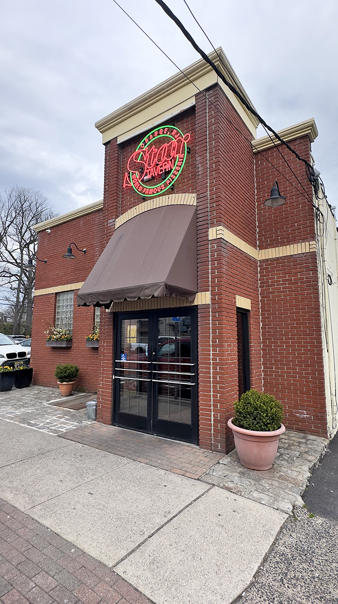 A beacon of cheesy delight! Star Tavern's neon sign promises pizza paradise, beckoning hungry souls like a moth to a flame.