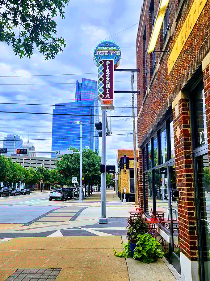 A neon beacon of cheesy delight! Joey's sign stands out like a pizza-shaped lighthouse, guiding hungry souls to their culinary destiny. 