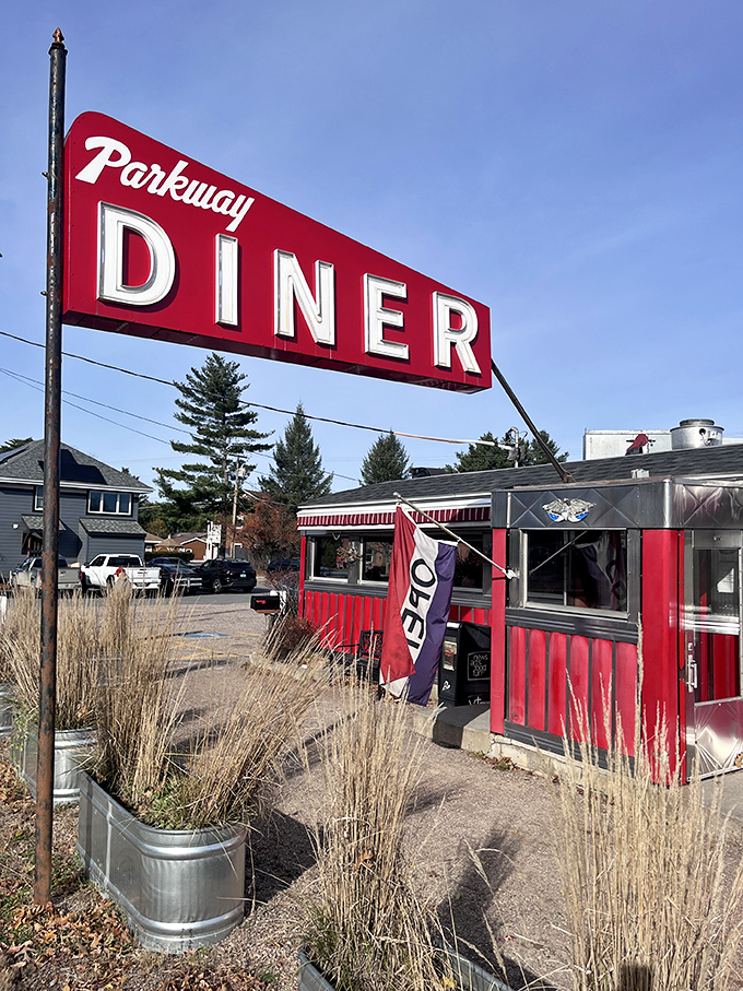 Step into a time machine disguised as a diner! This classic red-and-white exterior promises a journey back to the golden age of comfort food.