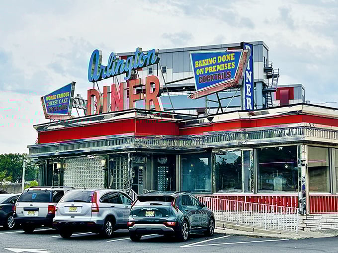 Neon dreams come true! The Arlington Diner's retro sign beckons like a lighthouse for the hungry, promising comfort in a sea of late-night cravings.