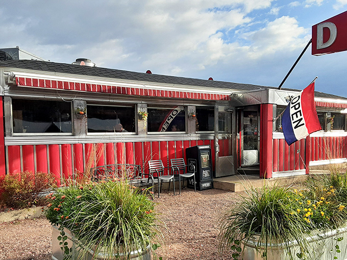 Step into a time machine disguised as a diner! This classic red-and-white exterior promises a journey back to the golden age of comfort food.