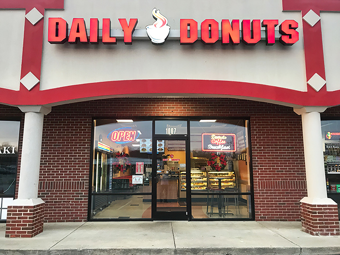 Welcome to donut paradise! Daily Donuts' cheery red sign promises a sugar-coated adventure that'll make your taste buds do a happy dance.