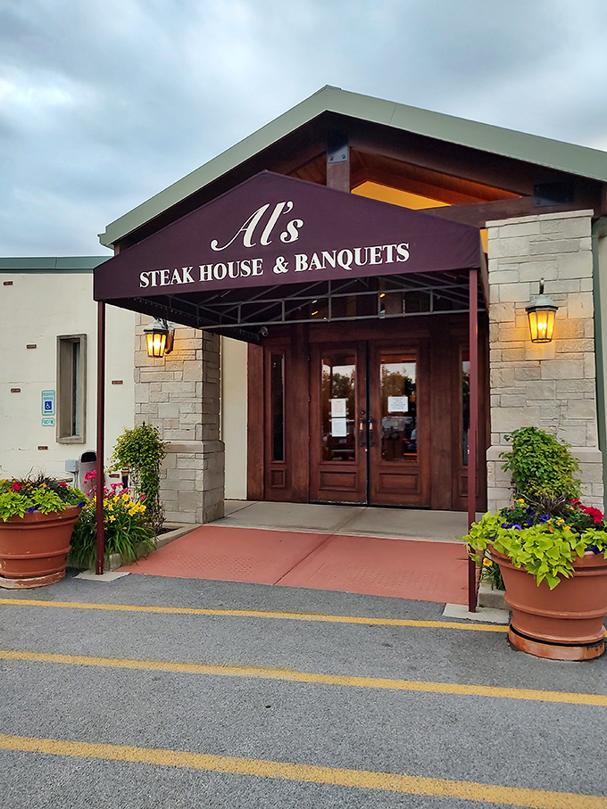 The burgundy awning and stone facade of Al's whispers "come inside" with more persuasion than any flashy neon sign ever could.