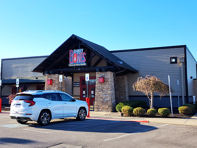 A rustic lodge or a barbecue haven? At Smokey Bones, it's deliciously both. This stone-faced facade promises a meaty adventure that'll make your taste buds do a happy dance.