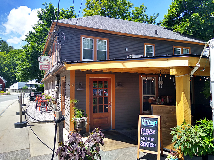 Welcome to flavor town! Krista's charming exterior invites you in with its cozy porch and colorful flag, promising a feast for all senses.