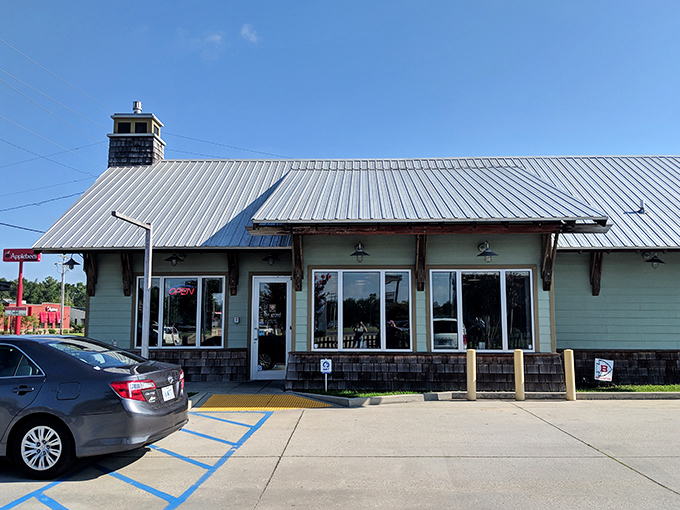 Welcome to Grind Coffee & Nosh, where rustic charm meets culinary delight. This unassuming exterior houses a treasure trove of flavors that'll make your taste buds do a happy dance.