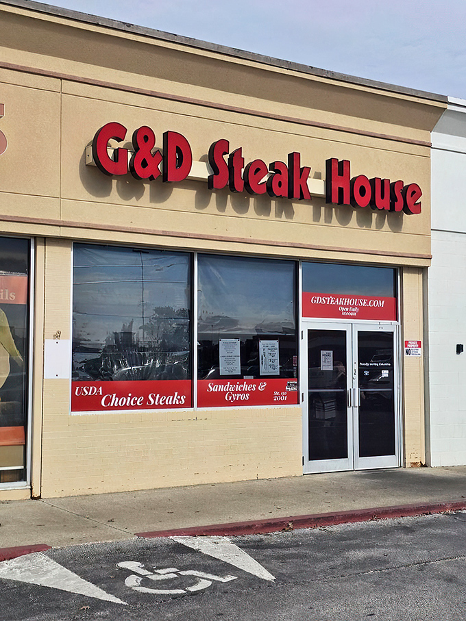 "G&D Steak House: Where the steaks are so good, they don't need fancy frills." This unassuming exterior hides a carnivore's paradise, proving that sometimes the best things come in simple packages.