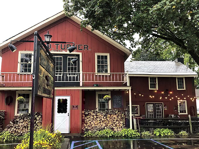 A red barn that's not for cows, but for carnivores! The Anvil Inn's exterior promises a cozy retreat for steak lovers.