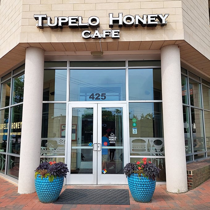 The warm, inviting fa&ccedil;ade of Tupelo Honey beckons with blue planters standing guard like Southern sentinels ready to welcome hungry visitors.