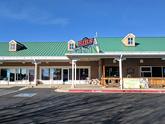 Welcome to barbecue paradise! Ribs Hickory Pit BBQ's charming exterior promises smoky delights that'll make your taste buds do a happy dance.