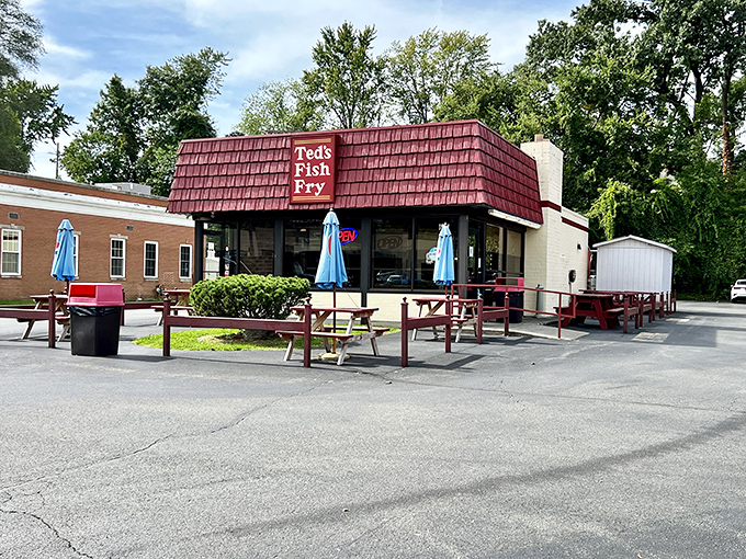 A red-roofed oasis of fried delights! Ted's Fish Fry stands like a beacon of comfort food, promising seafood salvation to weary travelers and locals alike.
