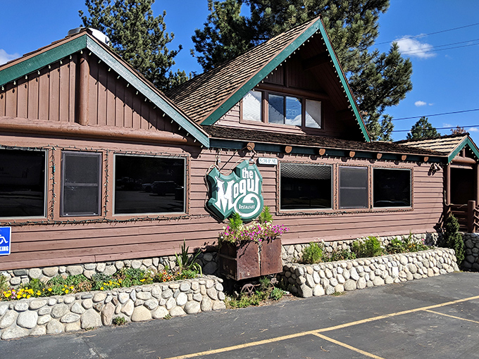 A cozy cabin in the woods? Nope, it's Mogul Restaurant, where comfort food dreams come true and mashed potato mountains await your conquest.