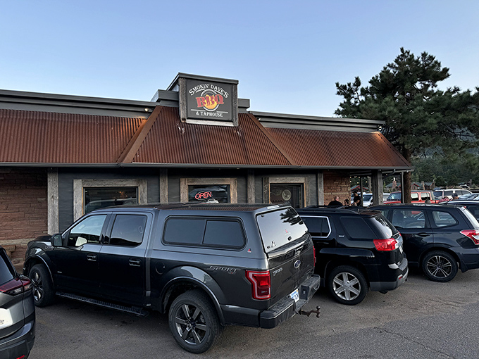The rustic red-roofed exterior of Smokin' Dave's beckons like a barbecue beacon in Estes Park. Happy hour every day? Count me in!
