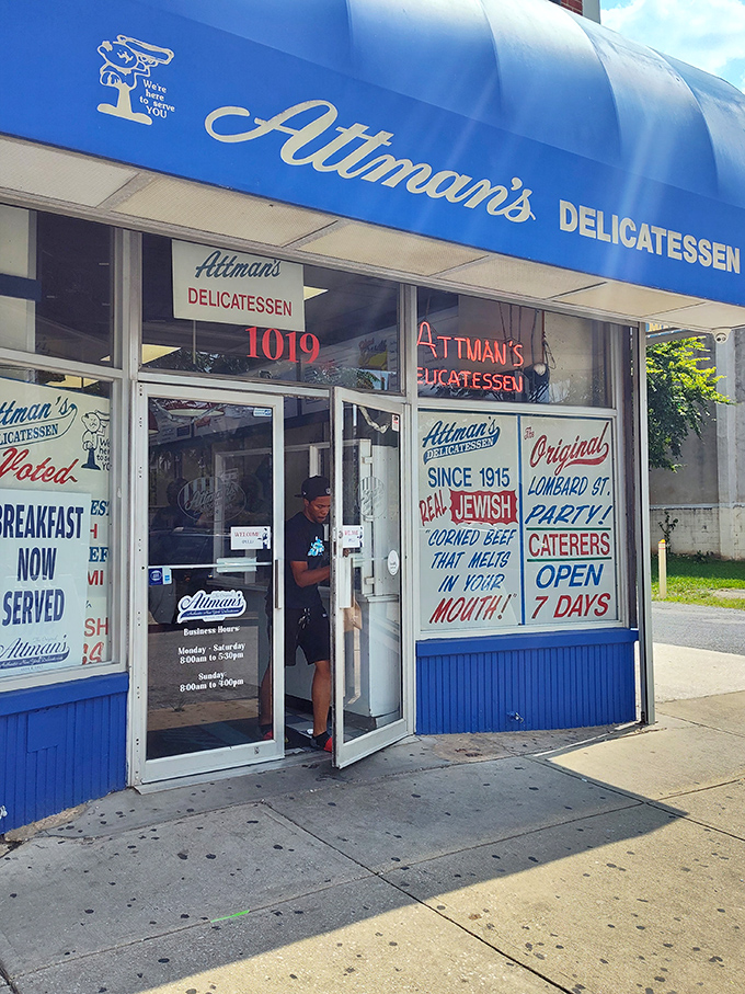 That iconic blue awning isn't just a sign&mdash;it's a beacon for sandwich lovers, promising a century-old tradition of deliciousness waiting inside.