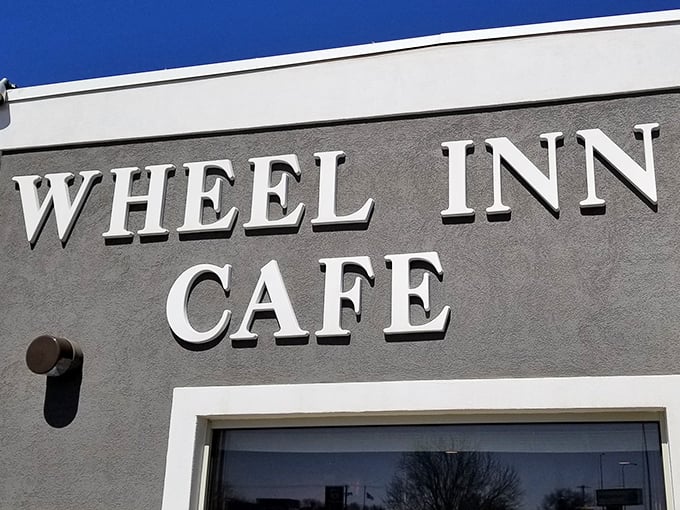 "Wheel Inn Cafe" - where culinary dreams come true and diets go to die. This unassuming exterior hides a treasure trove of comfort food that'll make your taste buds sing.
