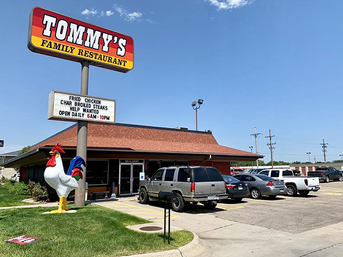 Welcome to flavor town! Tommy's Family Restaurant beckons with its iconic sign and a rooster statue that's more than just chicken feed.
