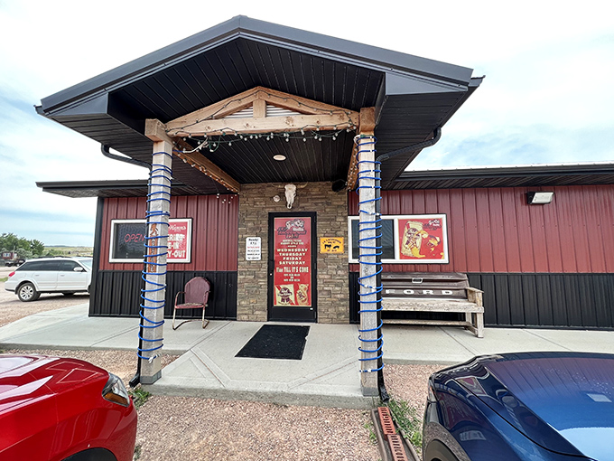 Welcome to BBQ paradise! J.R.'s Rhodehouse BBQ Pit's exterior promises a smoky adventure, with twinkling lights guiding you to flavor town.