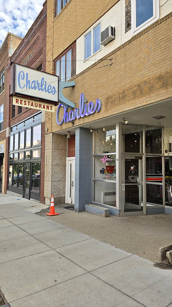 A slice of Americana, served with a side of neon! Charlie's sign glows like a beacon for hungry souls on Minot's Main Street.