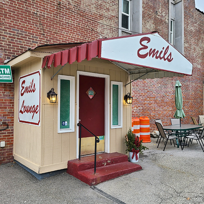 The unassuming entrance to Emil's Lounge stands like a time capsule in Rankin, promising culinary treasures behind that red door.