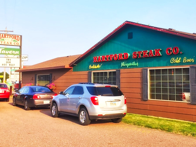 "Cold Beer" and hot steaks? Hartford Steak Co. Tavern's exterior promises a carnivore's paradise that's refreshingly unpretentious. It's like finding a treasure chest disguised as a garden shed.