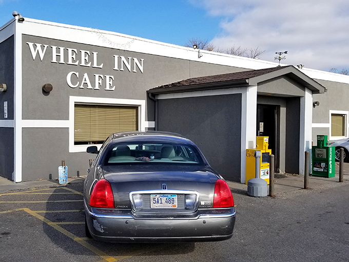 "Wheel Inn Cafe" - where culinary dreams come true and diets go to die. This unassuming exterior hides a treasure trove of comfort food that'll make your taste buds sing.