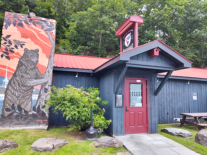 Rustic charm meets culinary magic! This unassuming blue building with a red roof is like finding a treasure chest of flavor in the Vermont woods.