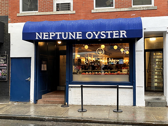 Neptune's siren call: A navy awning beckons seafood lovers into a world where oysters reign supreme and calories fear to tread.