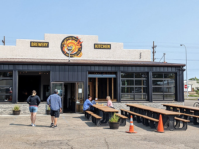 Welcome to flavor paradise! Laughing Sun Brewing Co.'s exterior promises a feast for the senses, with its inviting facade and cheerful logo beckoning food lovers and beer enthusiasts alike.