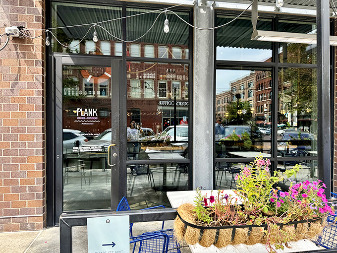 A coastal oasis in the heart of Omaha! Plank Seafood Provisions' inviting exterior promises a nautical adventure, complete with blue chairs that practically whisper "sit here and stay awhile."