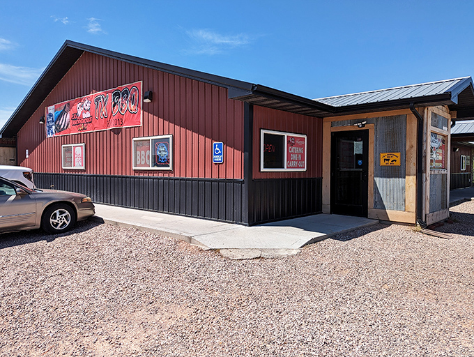 Welcome to BBQ paradise! J.R.'s Rhodehouse BBQ Pit's exterior promises a smoky adventure, with twinkling lights guiding you to flavor town.