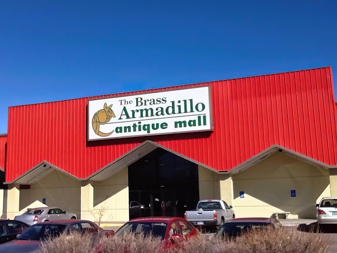 Welcome to the Brass Armadillo, where the exterior is as subtle as a neon sign in Vegas. This red-roofed wonderland promises treasures galore!
