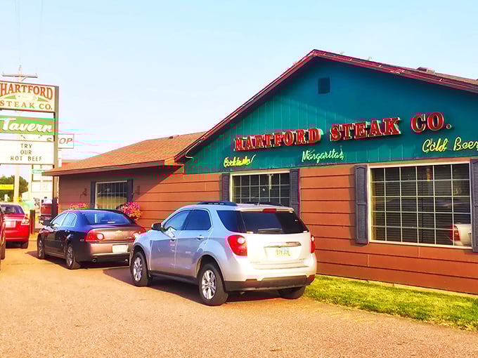 A beacon of beefy bliss! Hartford Steak Co. Tavern's sign promises prime rib that'll make your taste buds do a happy dance. Weekend plans: sorted.