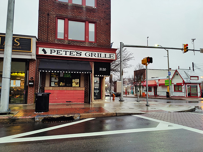 A beacon of breakfast bliss! Pete's Grille stands proud on the corner, its maroon awning a siren call to hungry Baltimoreans seeking their morning fix.