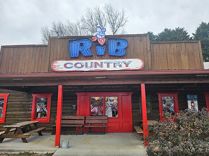Welcome to BBQ paradise! Rib Country's rustic charm and inviting red trim promise a smoky adventure that'll make your taste buds do a happy dance.