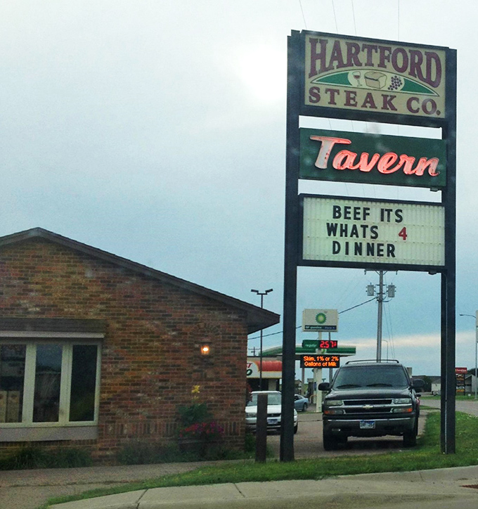 "Cold Beer" and hot steaks? Hartford Steak Co. Tavern's exterior promises a carnivore's paradise that's refreshingly unpretentious. It's like finding a treasure chest disguised as a garden shed.