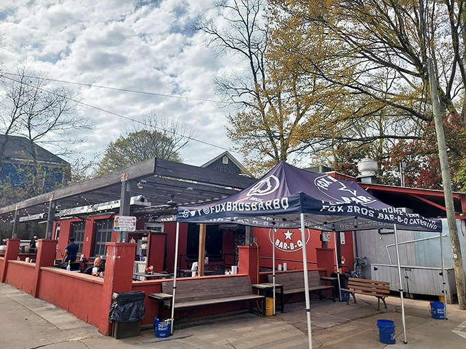 The bright red exterior of Fox Bros. Bar-B-Q stands like a barbecue beacon, promising smoky treasures within. No wonder license plates from across the South fill the parking lot.