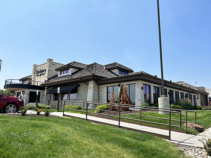 The stone facade of Cheddar's Scratch Kitchen stands like a comfort food castle, promising homestyle delights within its welcoming walls.