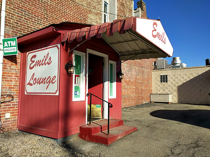 The unassuming entrance to Emil's Lounge stands like a time capsule in Rankin, promising culinary treasures behind that red door.