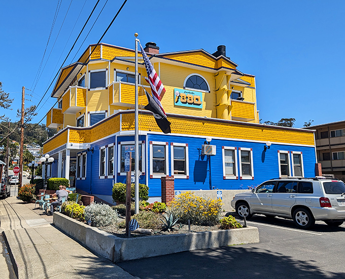 A sunshine-yellow beacon of BBQ bliss! This coastal culinary lighthouse stands out like a cheerful Big Bird in a sea of gray seagulls.