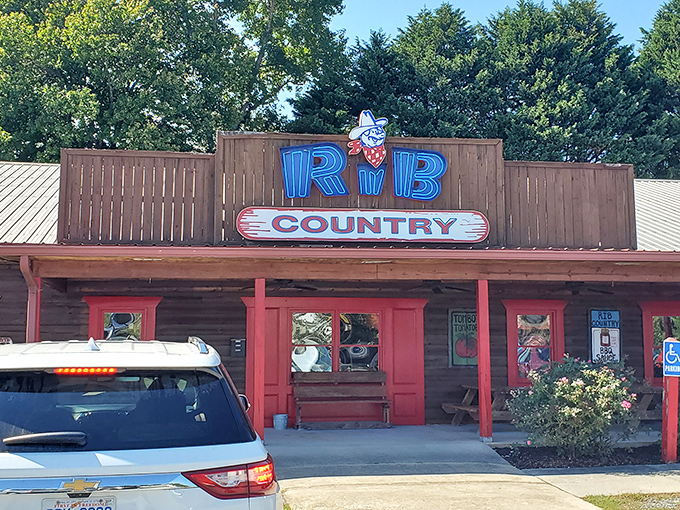 Welcome to BBQ paradise! Rib Country's rustic charm and inviting red trim promise a smoky adventure that'll make your taste buds do a happy dance.