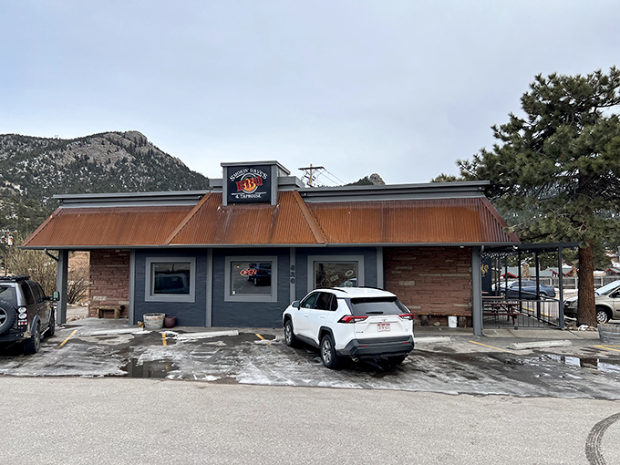 The rustic red-roofed exterior of Smokin' Dave's beckons like a barbecue beacon in Estes Park. Happy hour every day? Count me in!