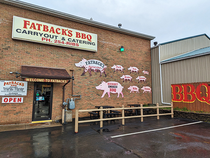 The unassuming brick exterior of Fatback's BBQ hides culinary treasures within. Those pig cutouts aren't just decoration&mdash;they're a roadmap to happiness.