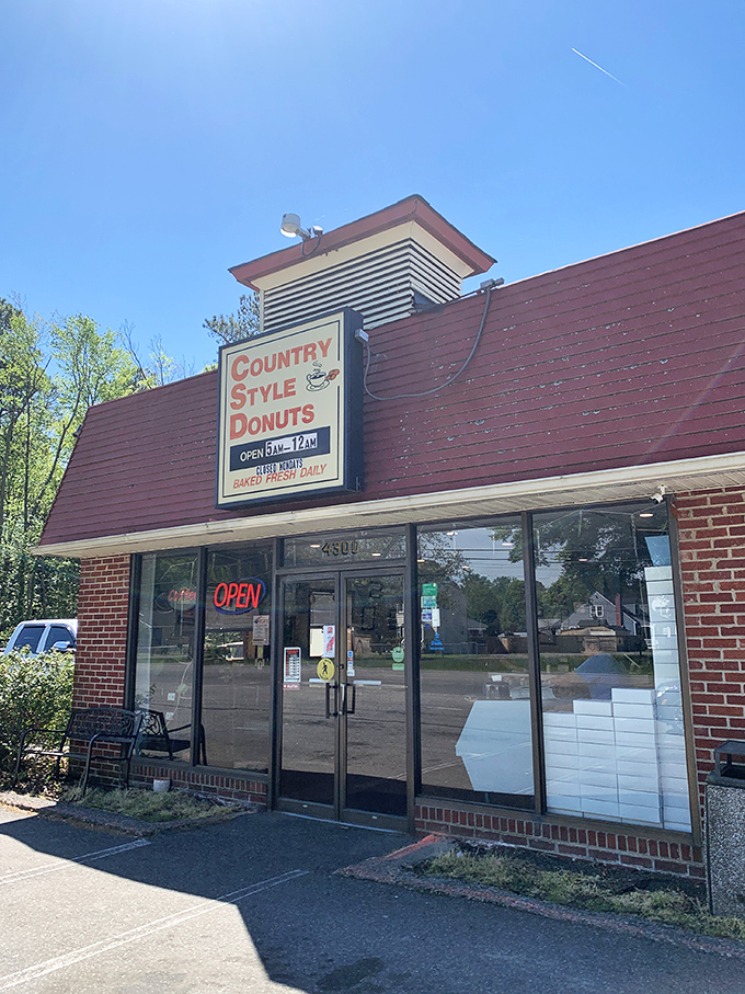 The humble red-roofed kingdom where donut dreams come true. Country Style's unassuming exterior hides Richmond's sweetest secret, open from dawn till midnight.