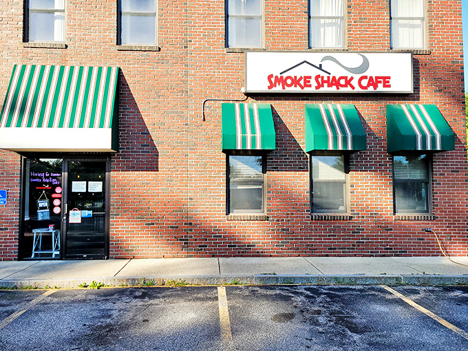 A brick facade that promises smoky delights! The Smoke Shack Cafe's exterior is like a siren song for BBQ lovers, with those green awnings beckoning you inside.