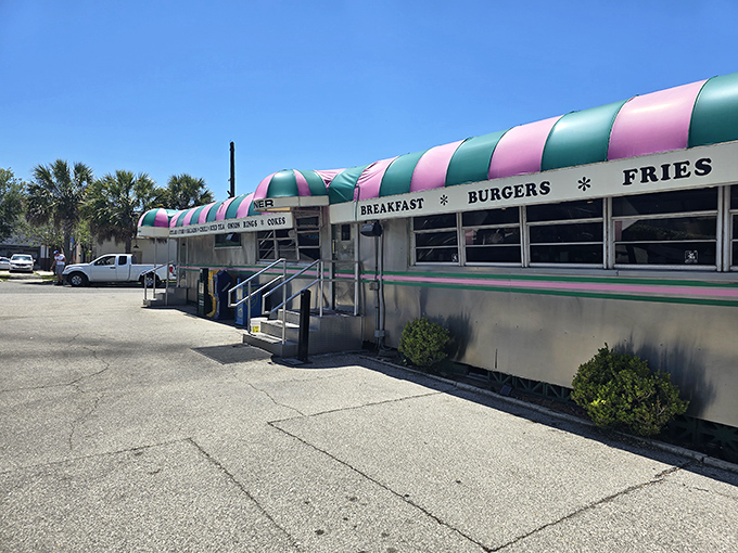 Step into a time machine disguised as a diner! Angel's Dining Car's exterior is a retro rainbow of promise, beckoning burger lovers with its iconic striped awning.